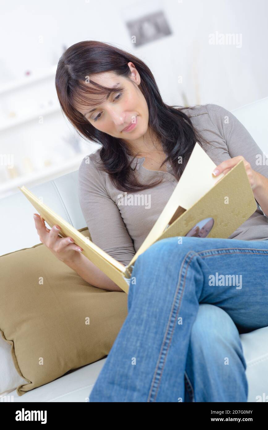 Woman alone photo album hi-res stock photography and images - Alamy
