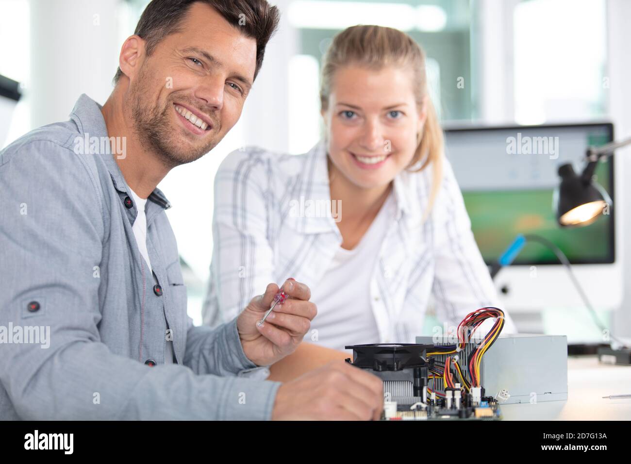portrait of male and female computer technicians Stock Photo - Alamy