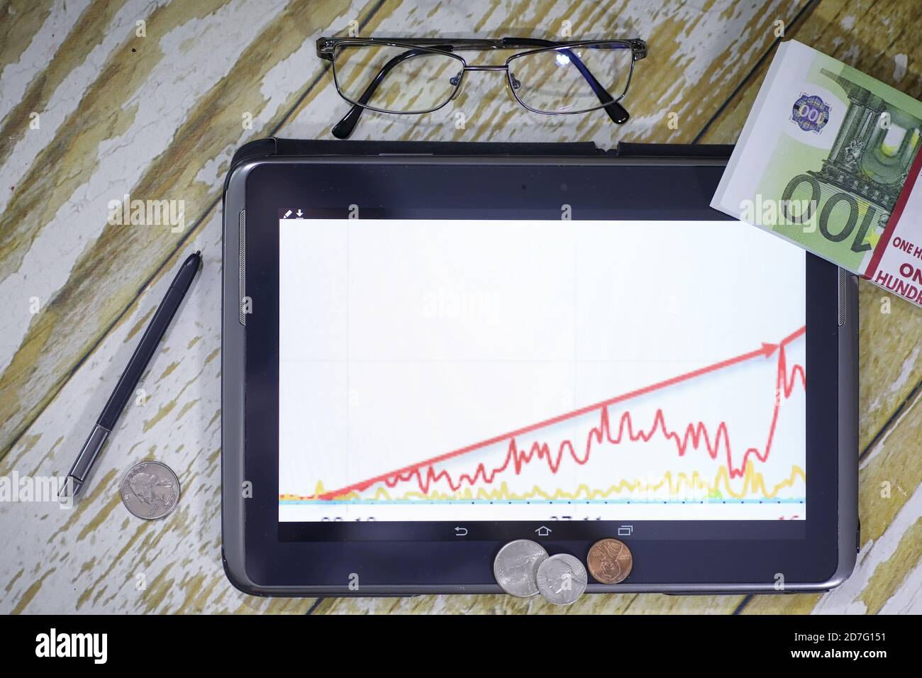 The graph of income growth. Electronic tablet with a graph of growth ...