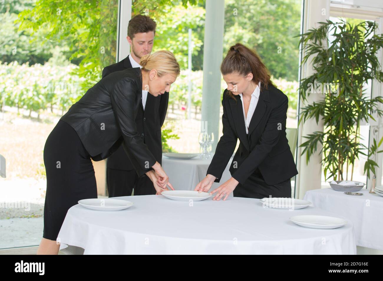 restaurant table manager and workers Stock Photo - Alamy