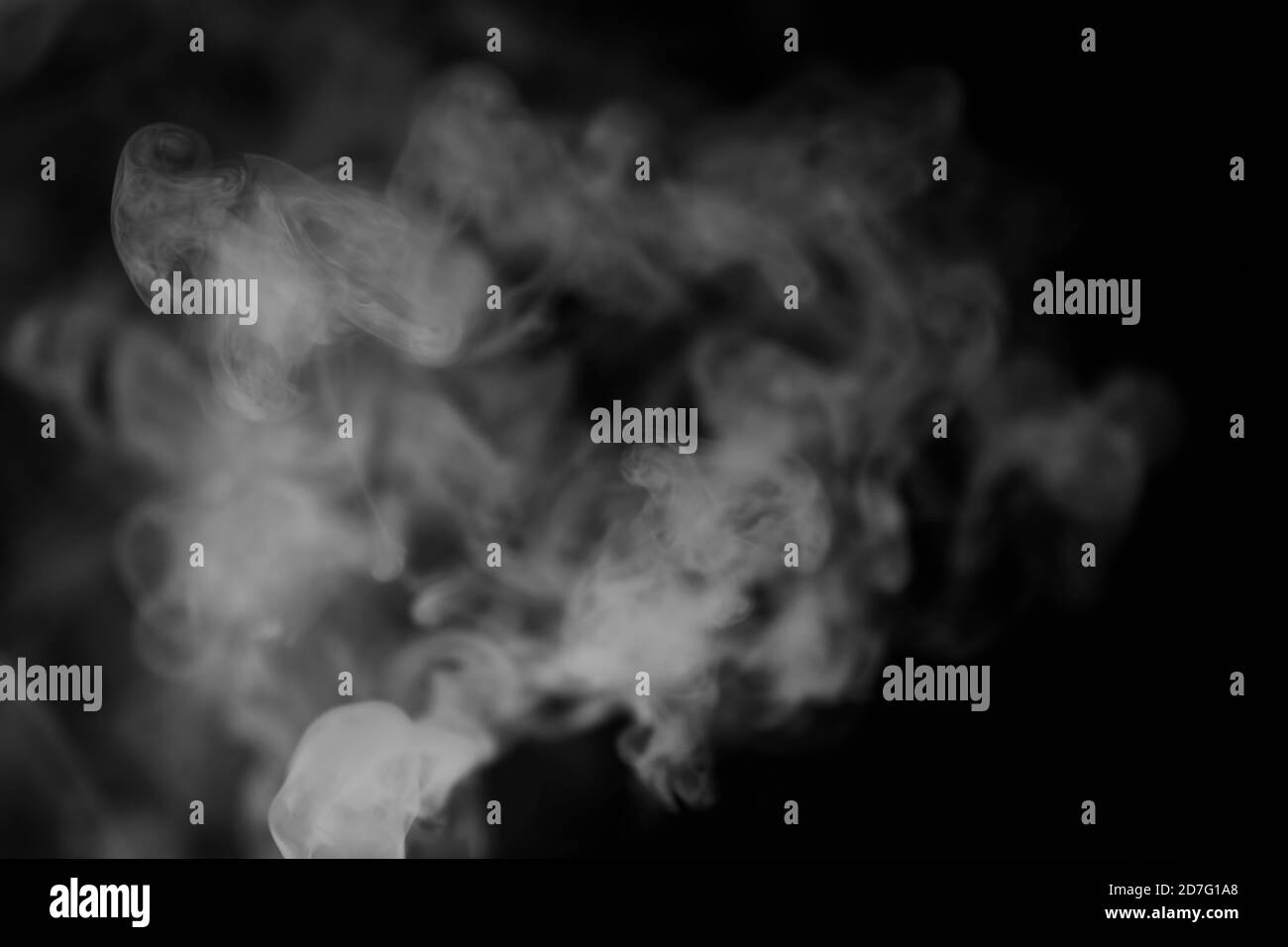 White smoke on a black background. Texture of smoke. Clubs of white ...