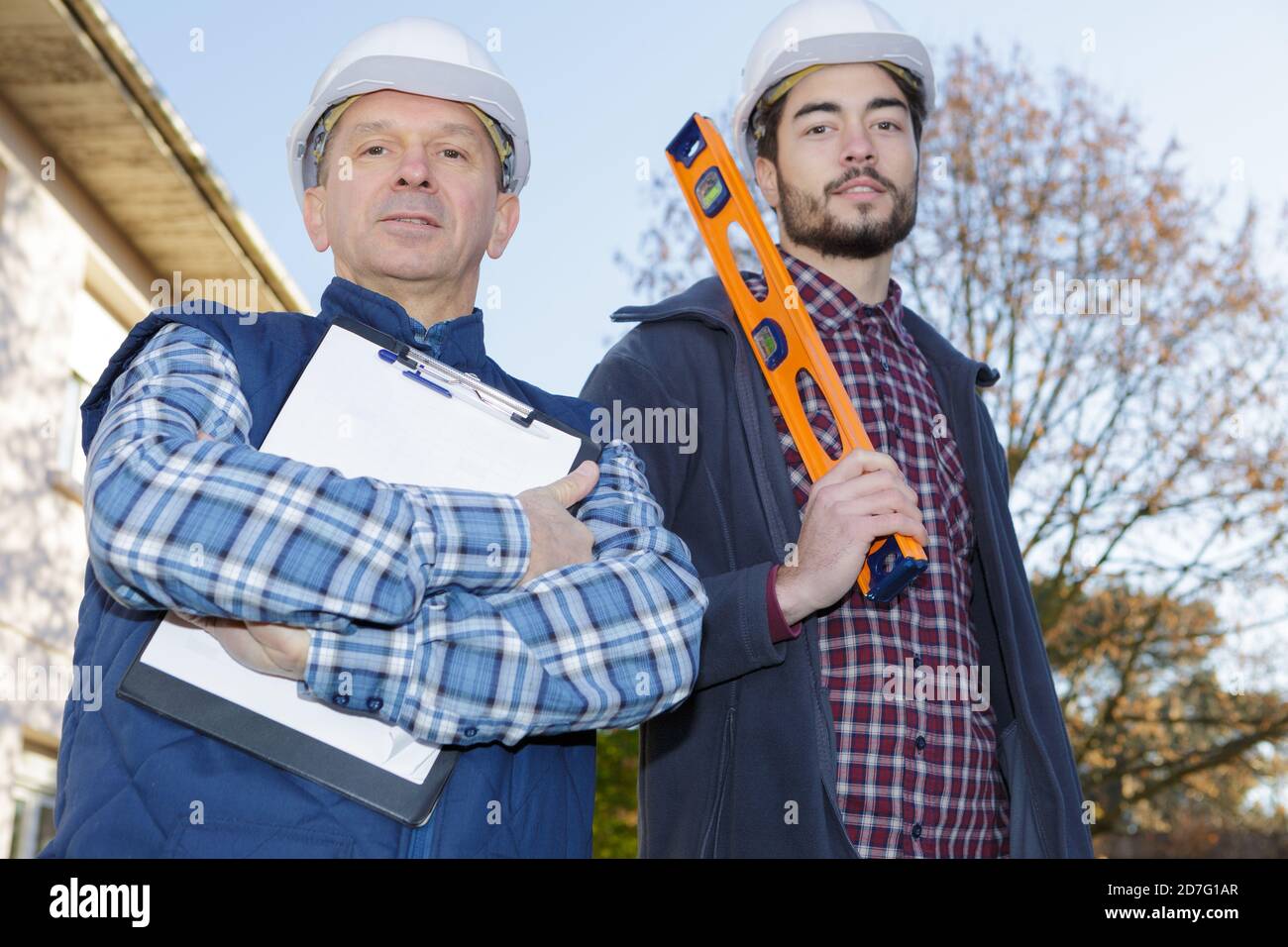 construction worker posing with clipboard and spirit level Stock Photo ...