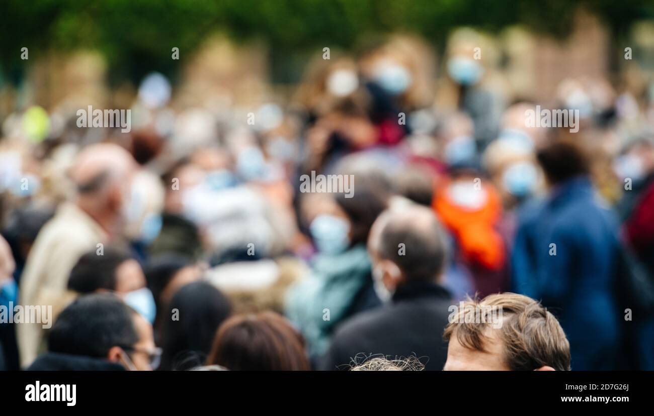 Large crowd of people with mask in central square place of a French ...