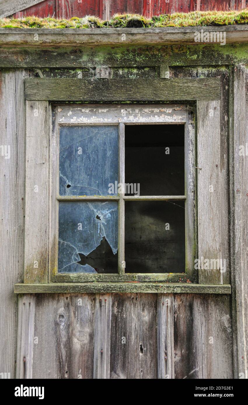Old weathered grey red barn wall with a broken window Stock Photo - Alamy