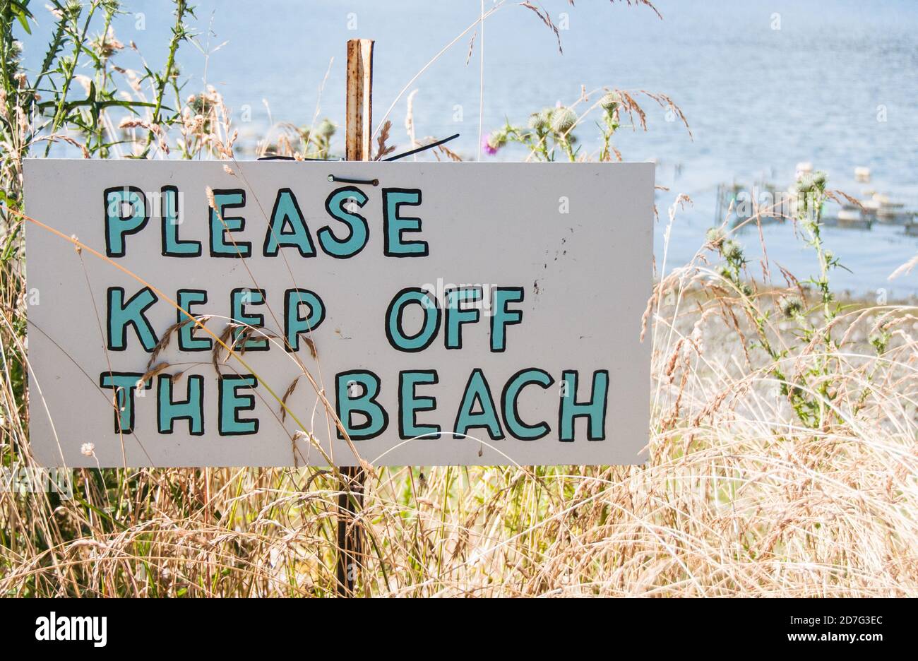 Handmade sign Please Keep Off The Beach Stock Photo - Alamy