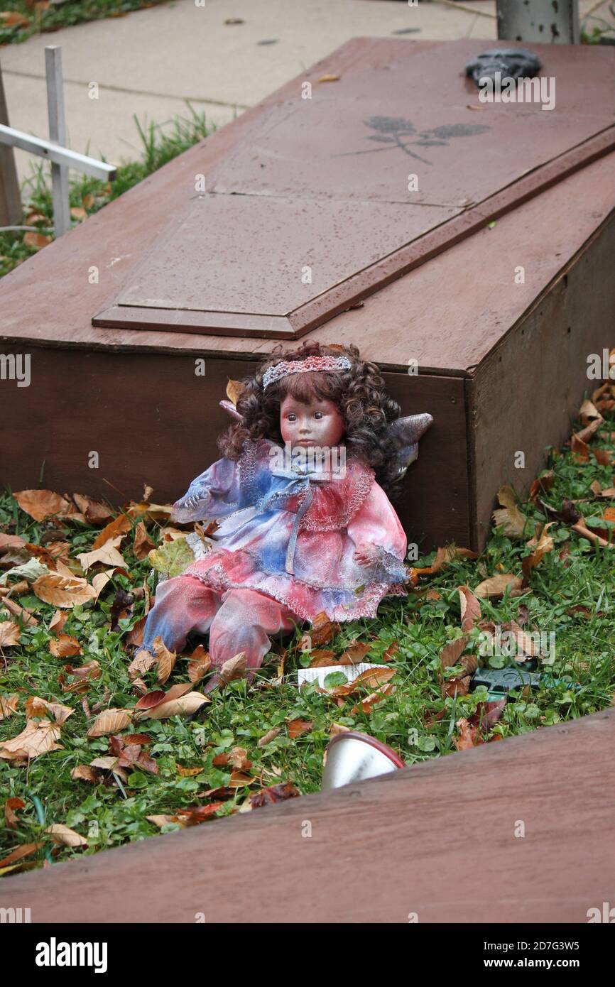A gory Halloween lawn decoration of a bloody girl doll Stock Photo - Alamy