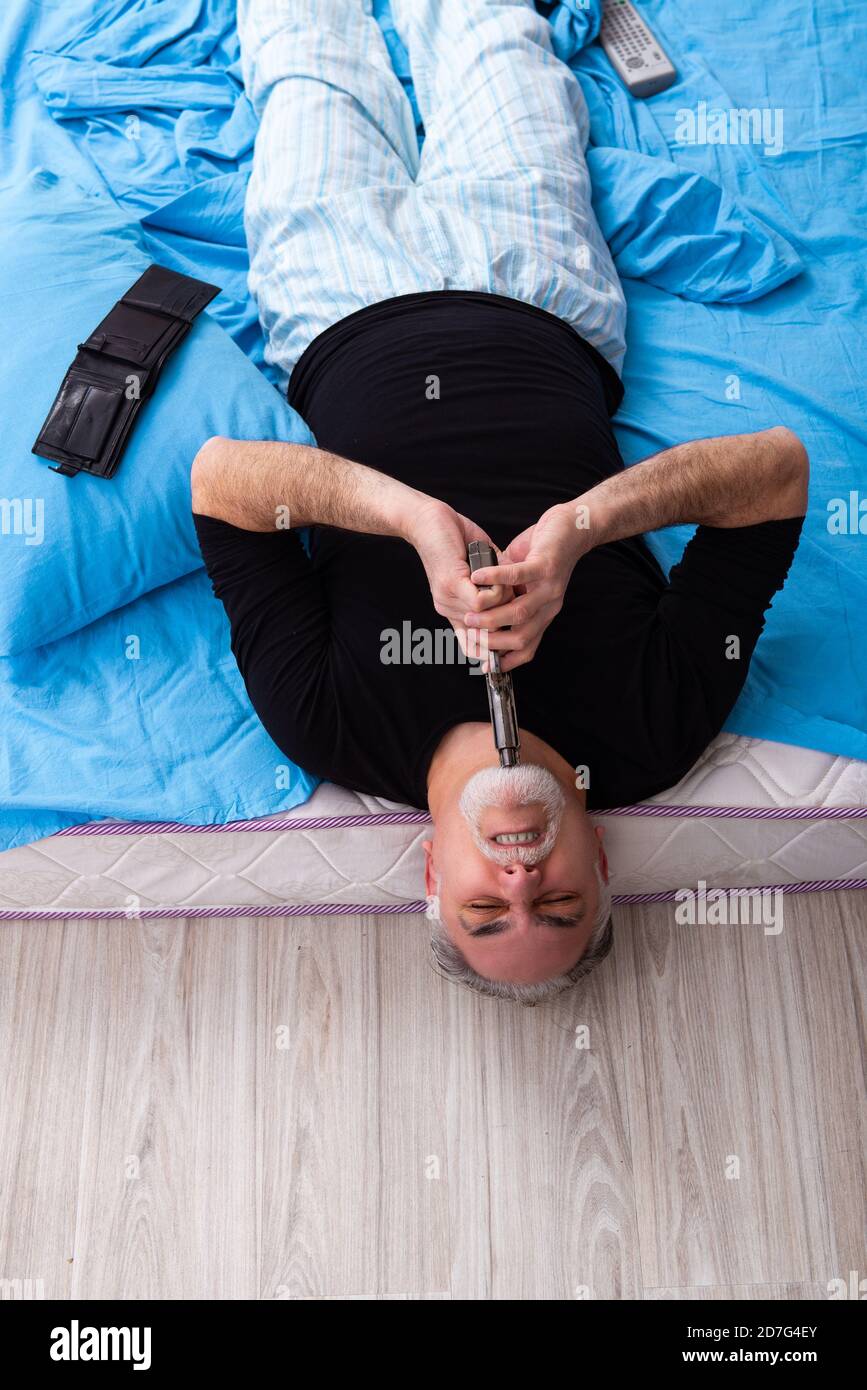 Old man in depression mode at home Stock Photo - Alamy