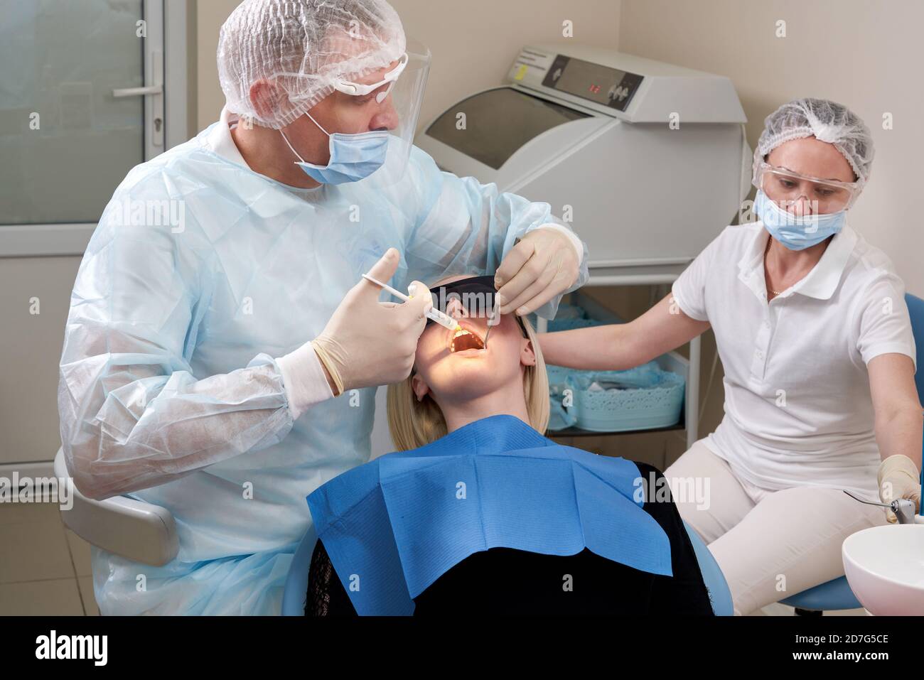 Dentist making local anesthesia shot before surgery Stock Photo - Alamy