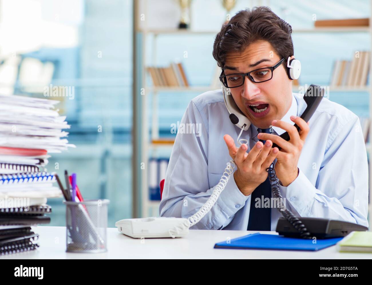The unhappy angry call center worker frustrated with workload Stock ...