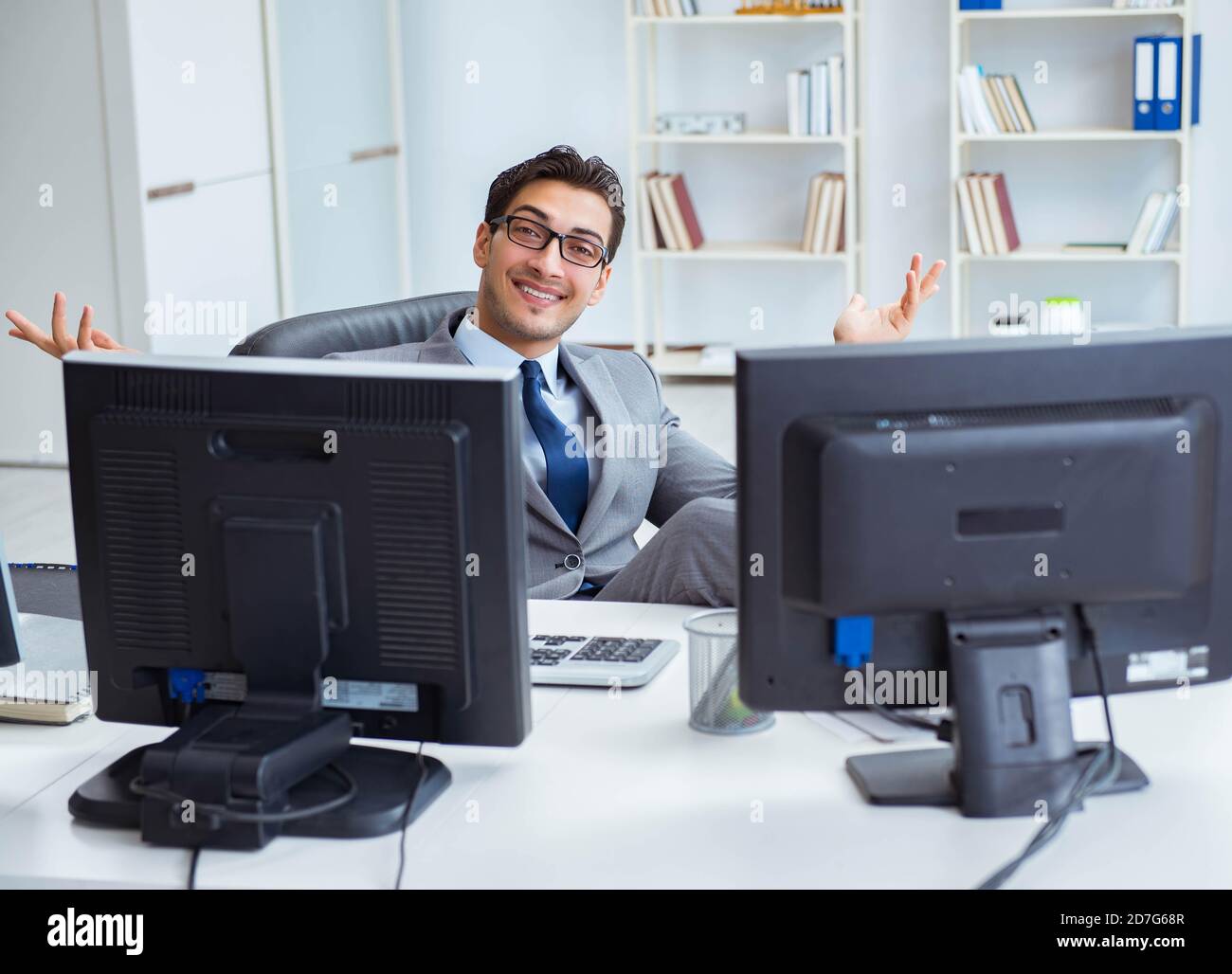 The businessman sitting in front of many screens Stock Photo - Alamy