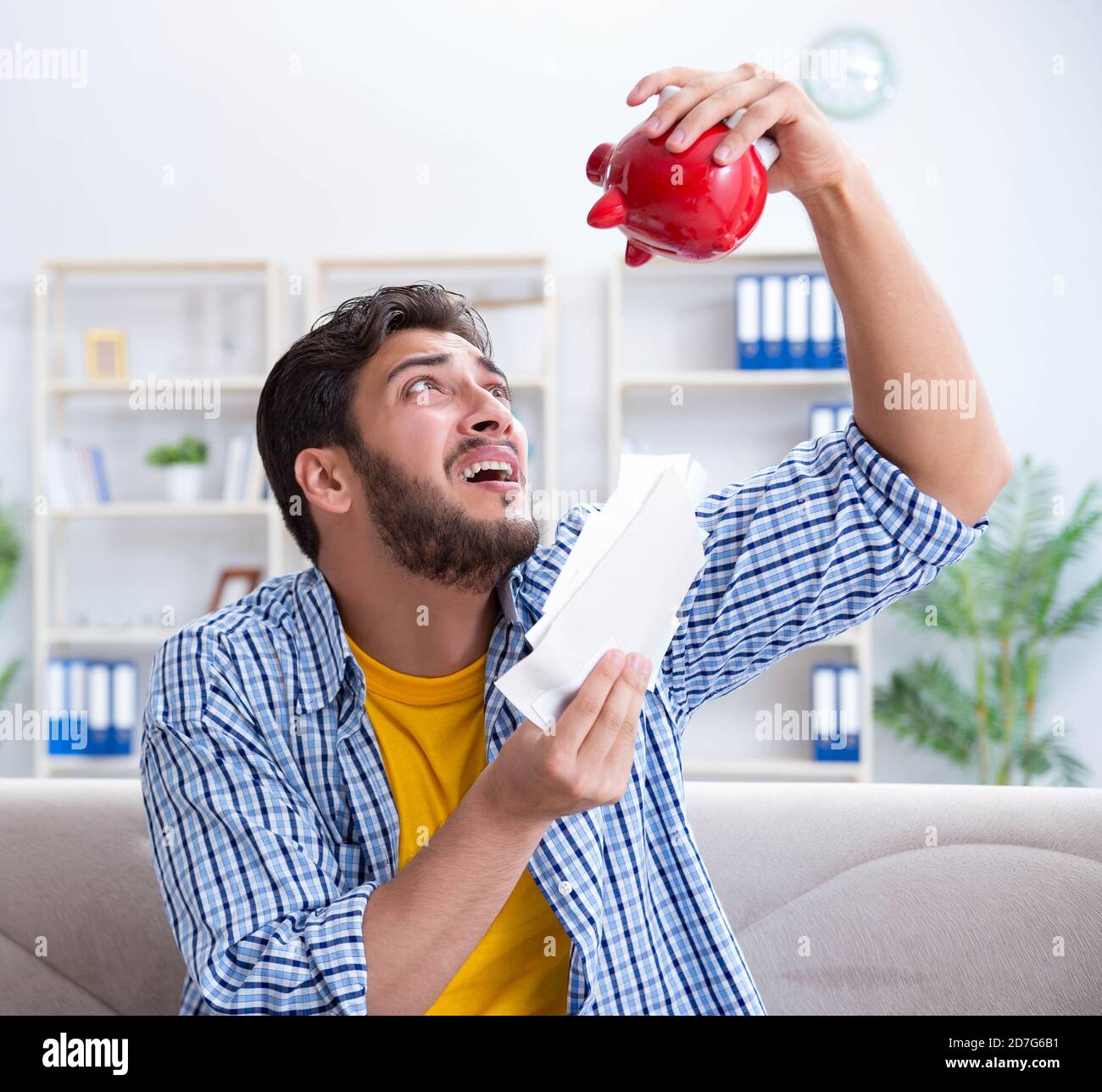The man angry at bills he needs to pay Stock Photo - Alamy
