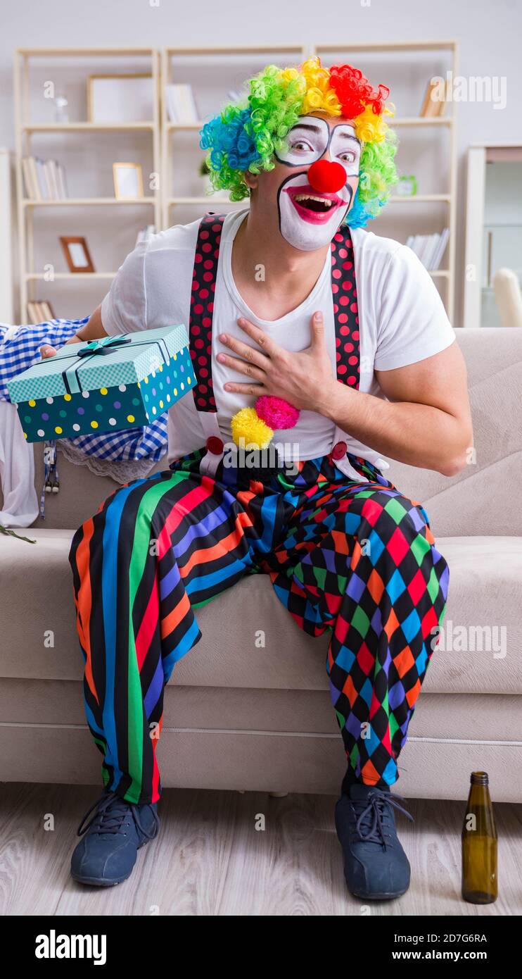 The drunk clown celebrating having a party at home Stock Photo - Alamy
