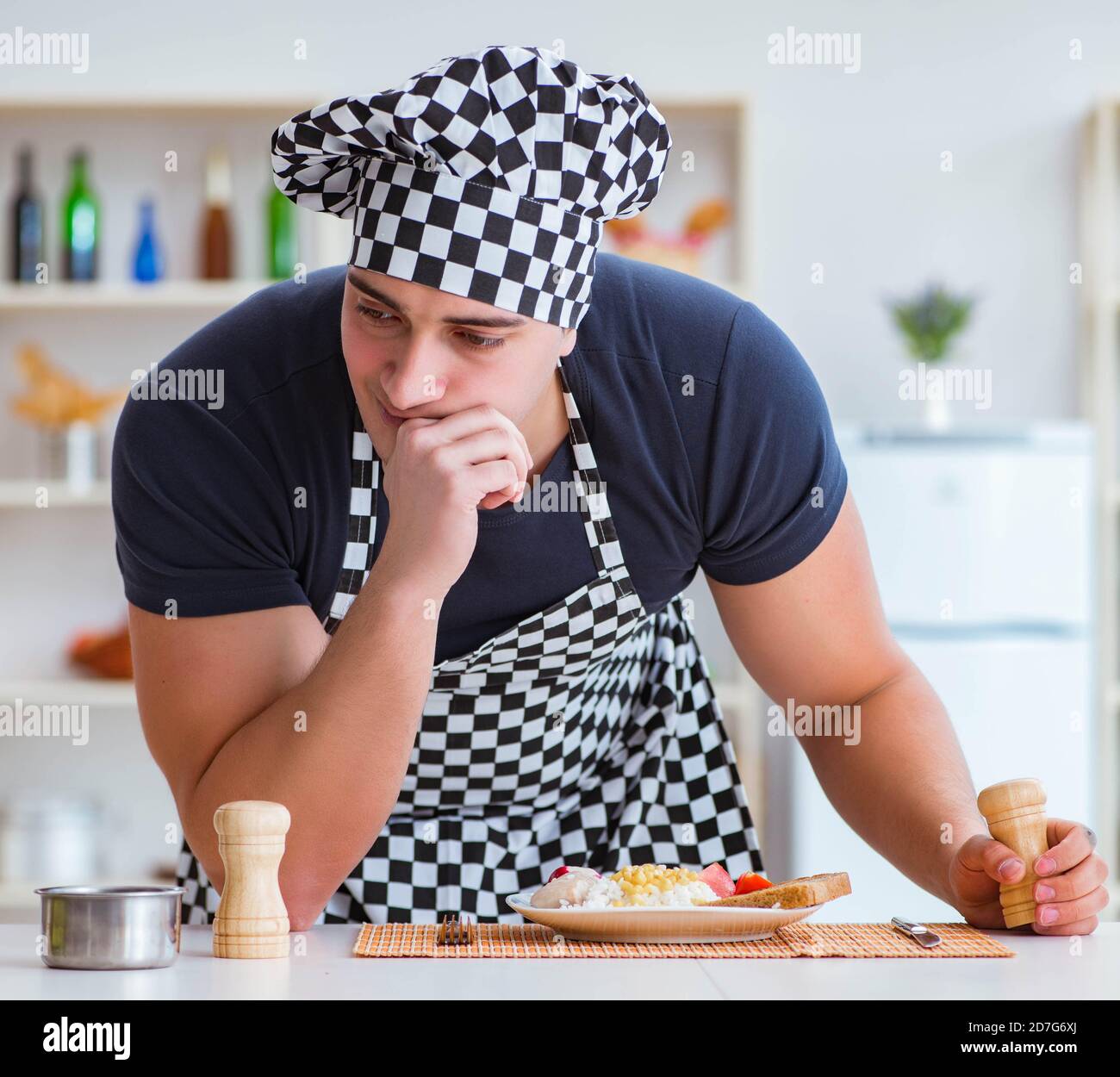 The chef cook cooking a meal breakfast dinner in the kitchen Stock ...