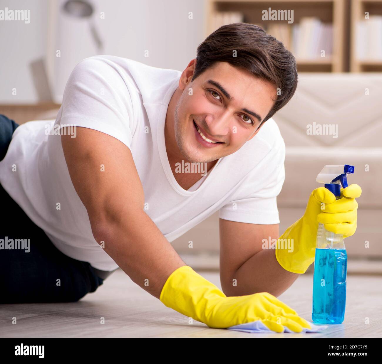 The man husband cleaning the house helping wife Stock Photo - Alamy