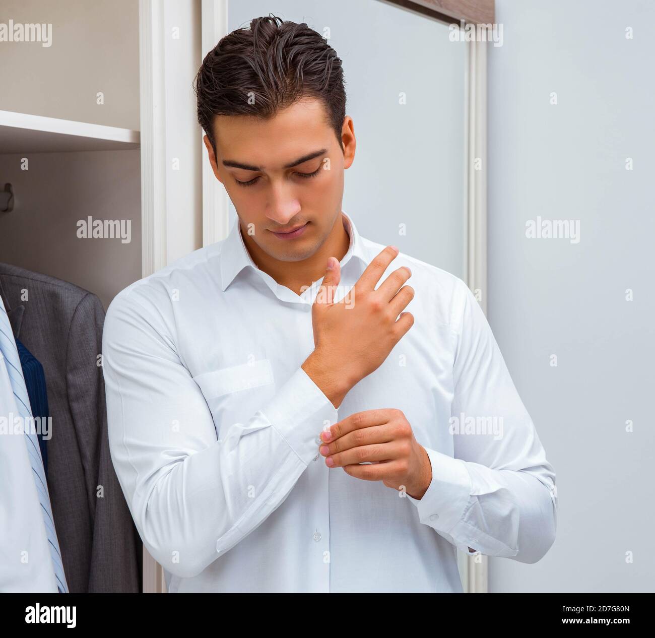 The businessman dressing up for work Stock Photo - Alamy