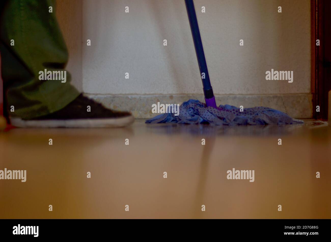 Cleaning of a smooth floor with a mop Stock Photo - Alamy