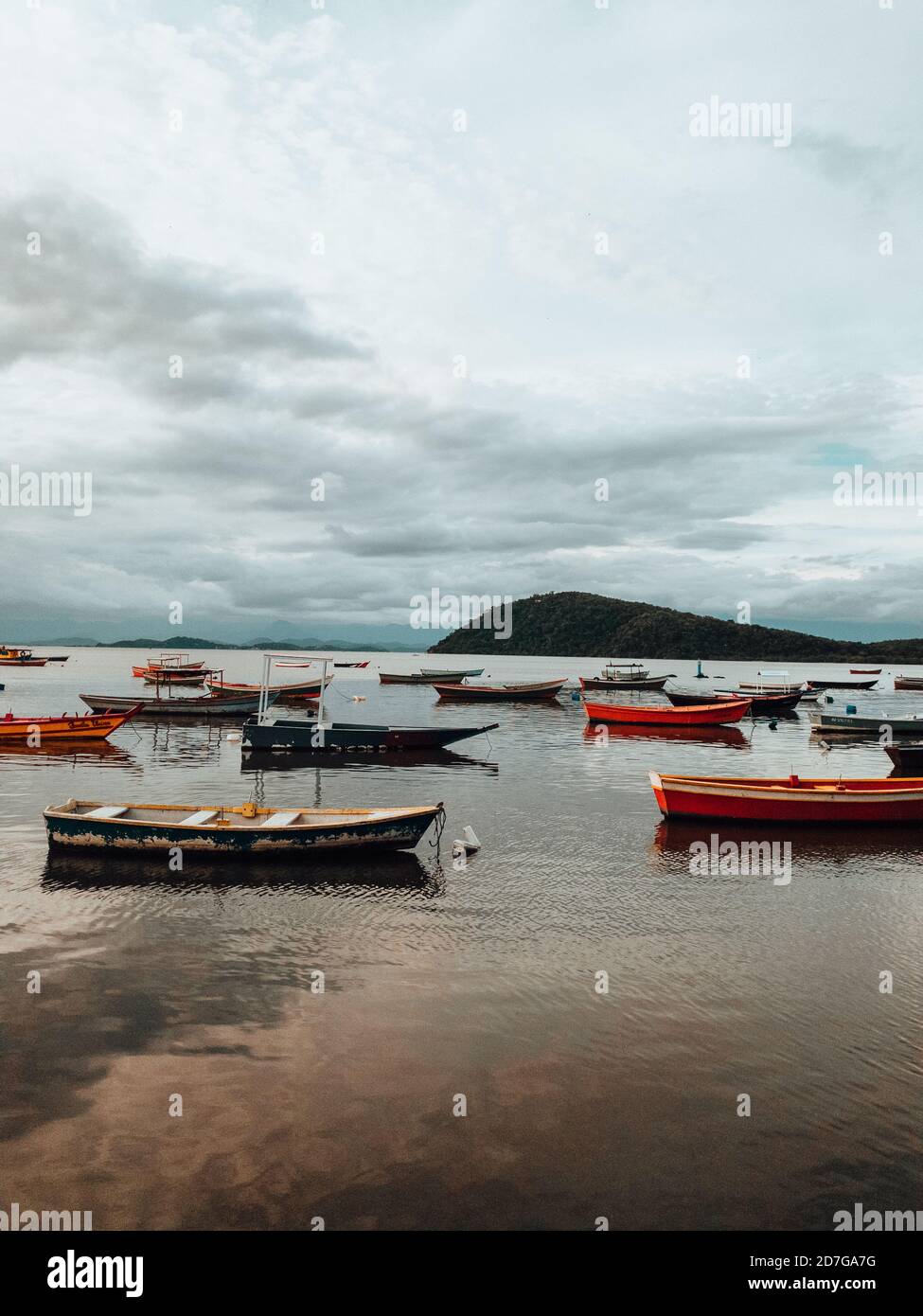 Beautiful landscape shot of the boats and the beach during the sunset ...