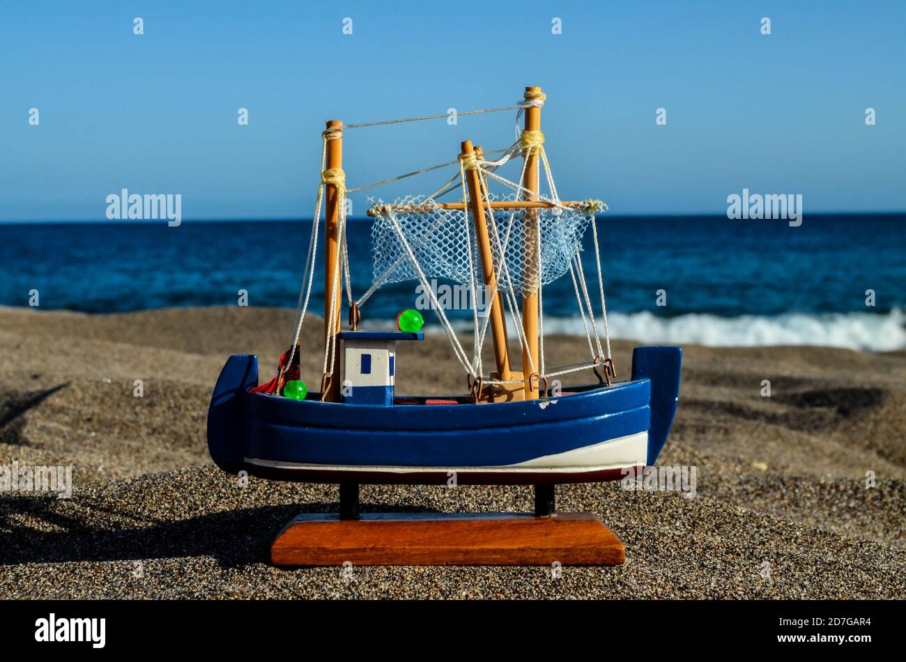 Toy Boat on the Sand Beach Stock Photo - Alamy