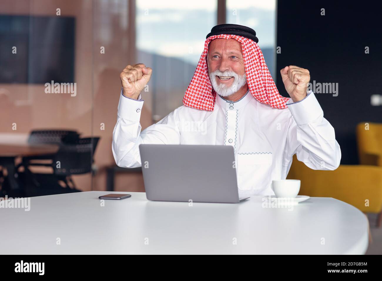 Portrait middle aged businessman celebrating hi-res stock photography ...
