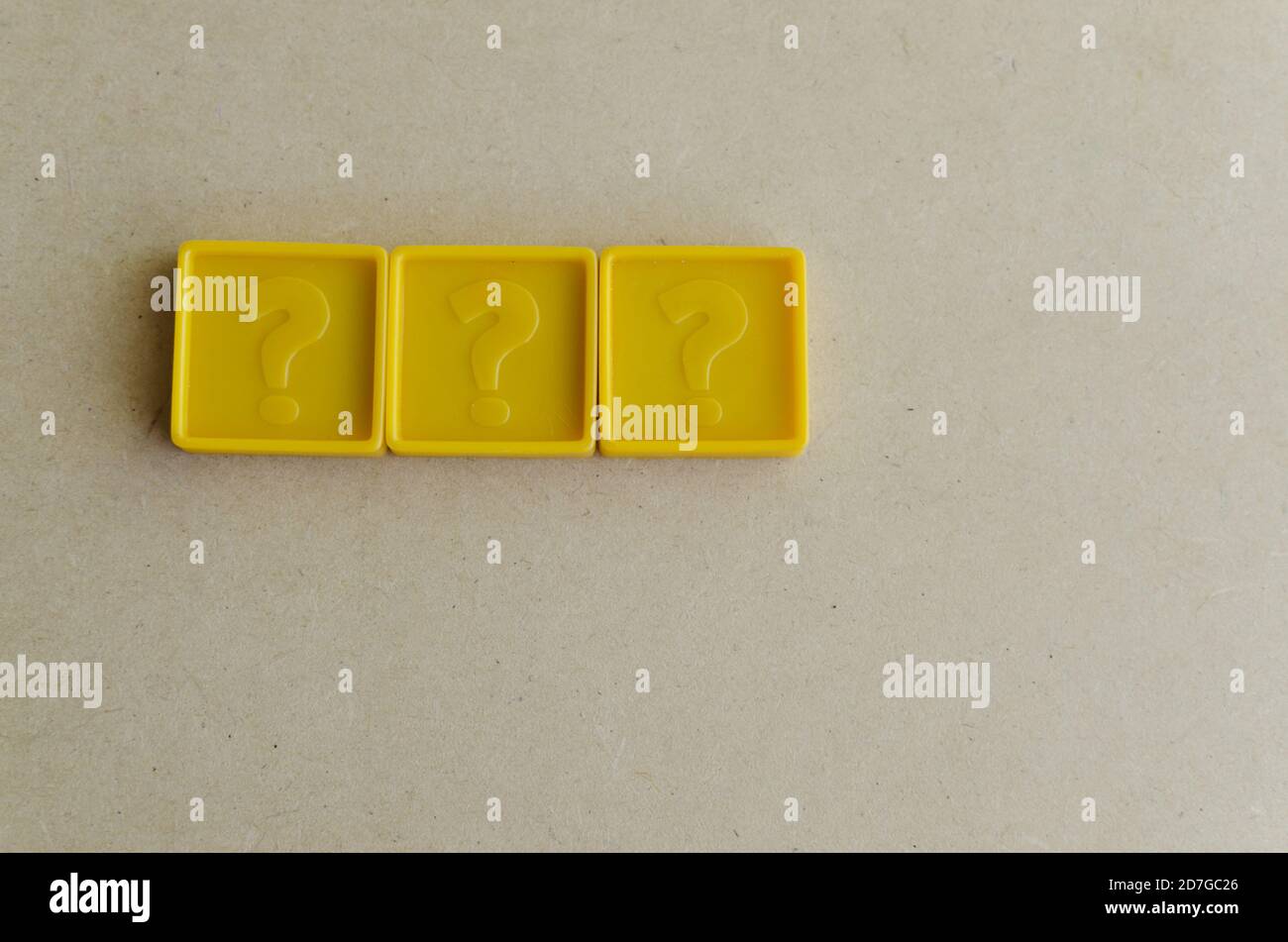 Top view of yellow chips with question mark and professions Stock Photo ...