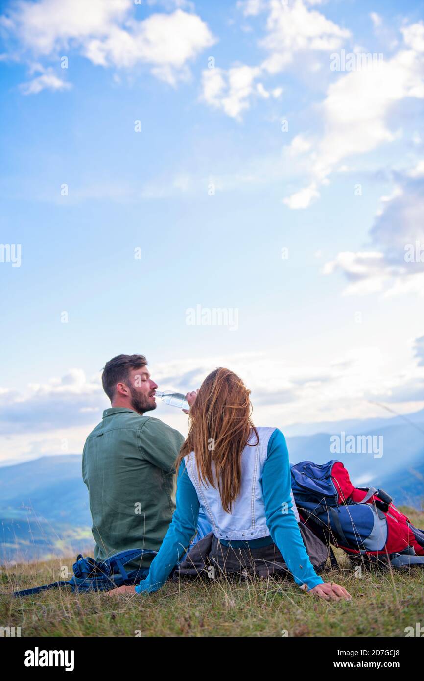Family taking break on hike hi-res stock photography and images - Alamy