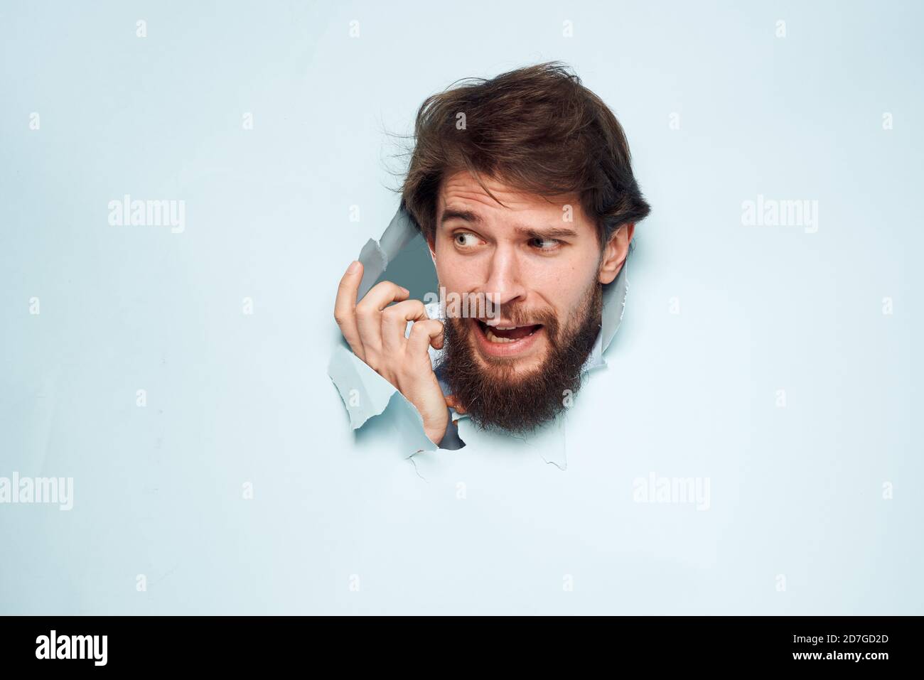 Man peeking out from behind wall hi-res stock photography and images ...