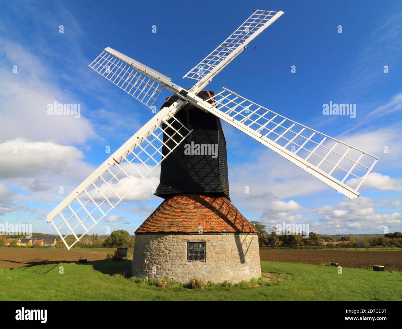 Stevington, UK. 22nd Oct, 2020. Historic windmill under blue autumn ...