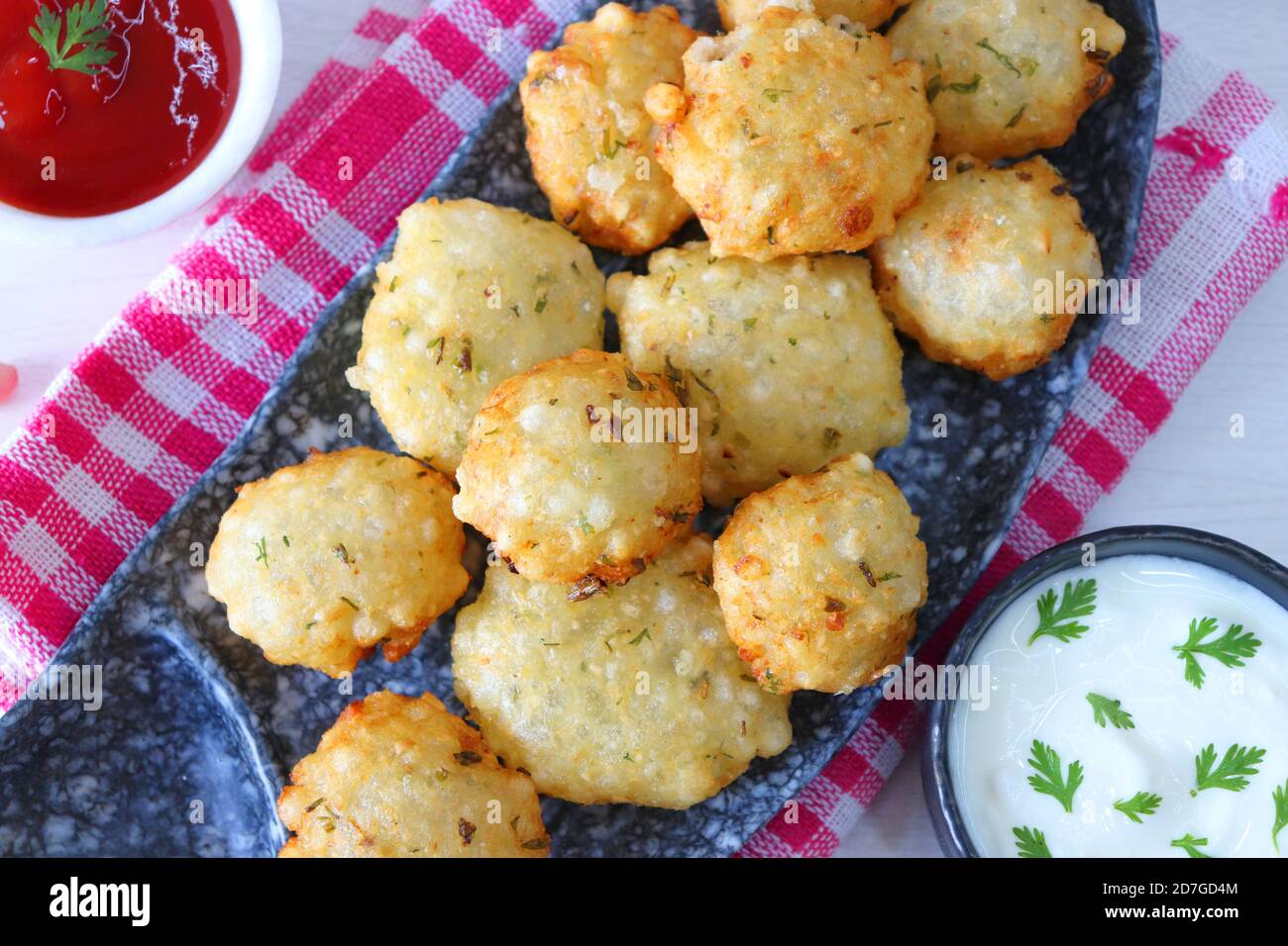 Sabudana vada or Sago fried fitters served with Curd or yogurt and ...