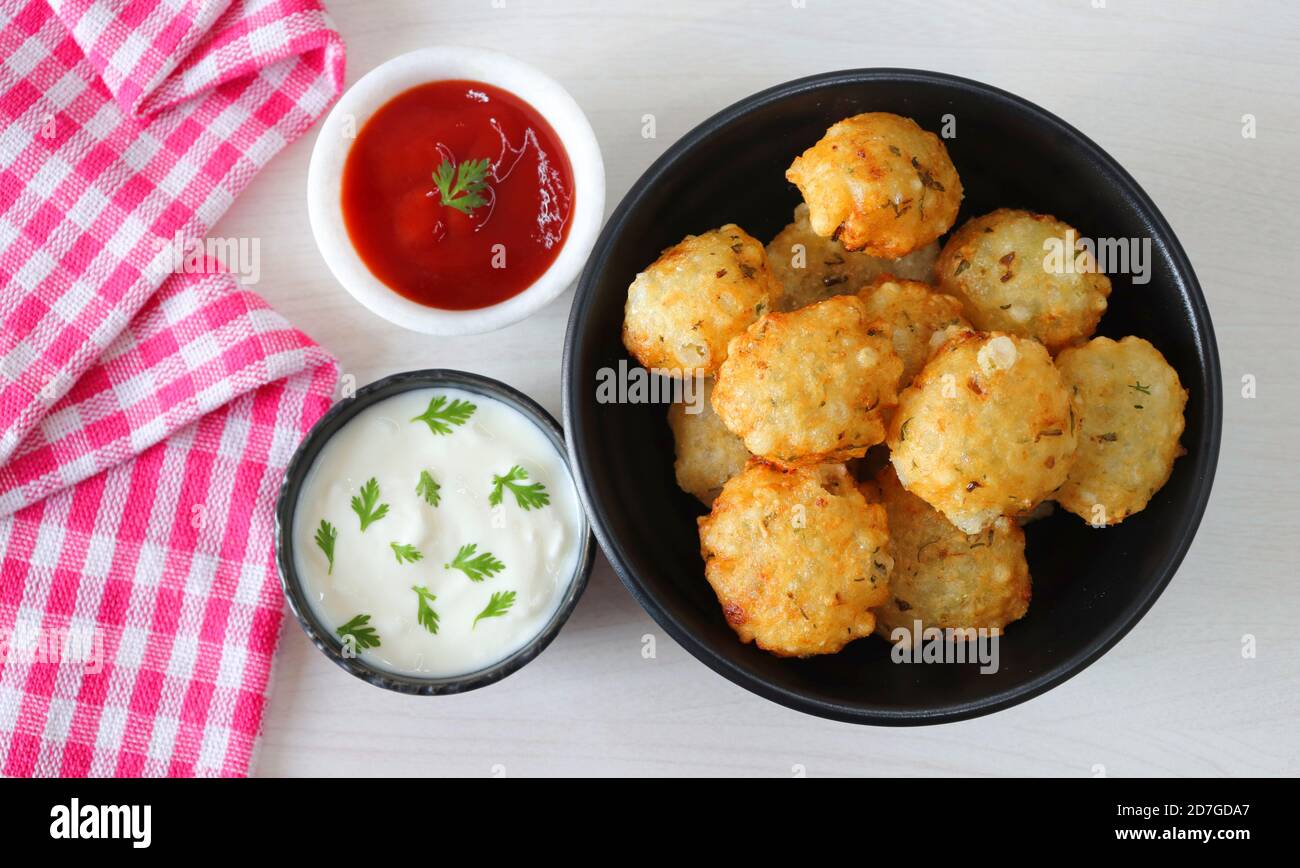 Sabudana vada or Sago fried fitters served with Curd or yogurt and ...