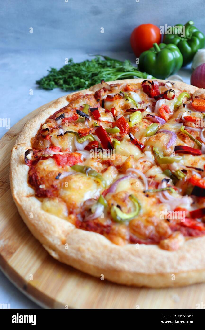 Food- Traditional Italian veggie pizza. Toppings are capsicum, corn ...
