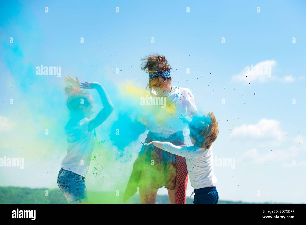 Kids playing with colored splash powder and color dust Stock Photo - Alamy