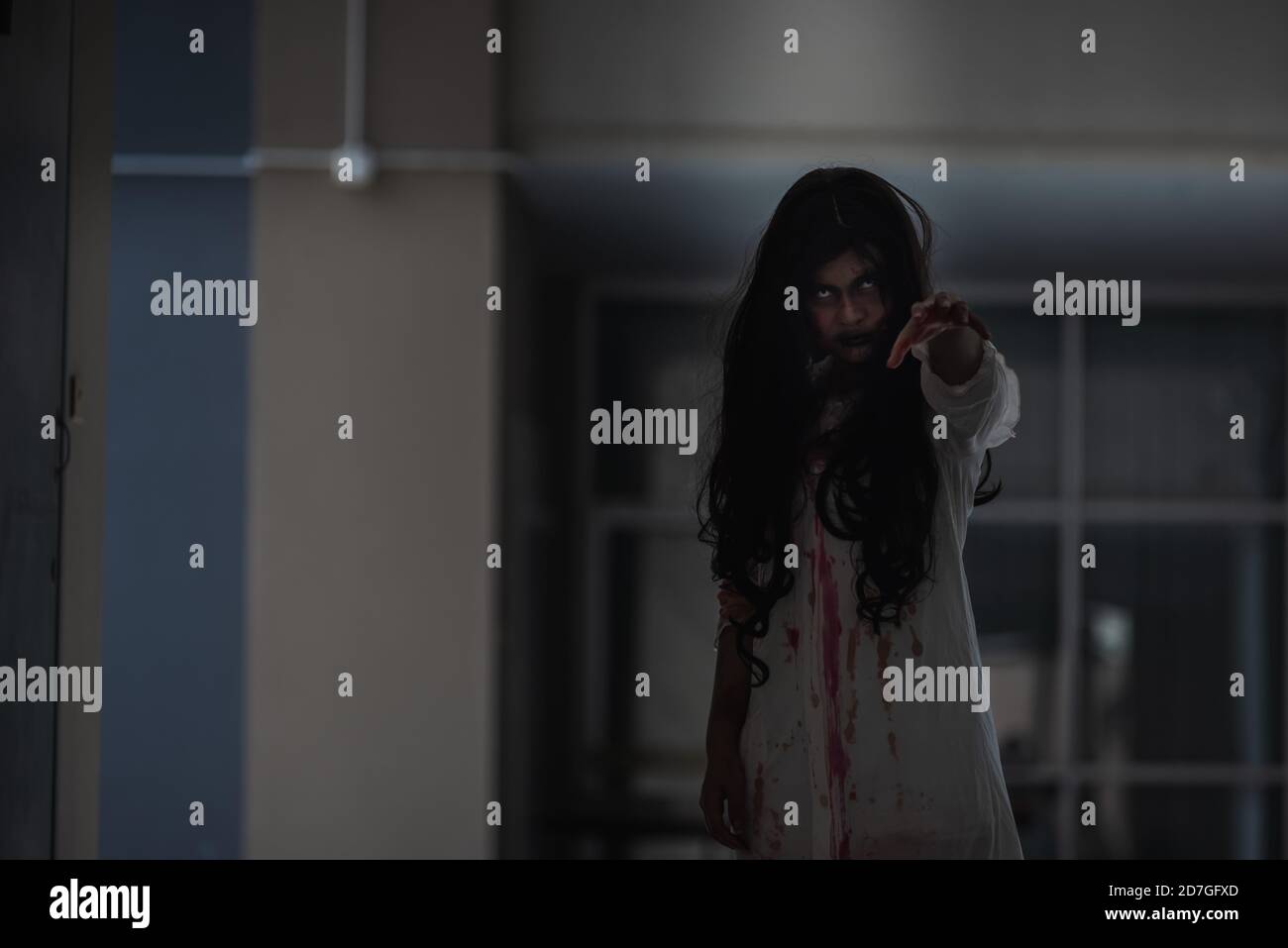 Horror evil woman ghost creepy in a dark room at house. The female ...