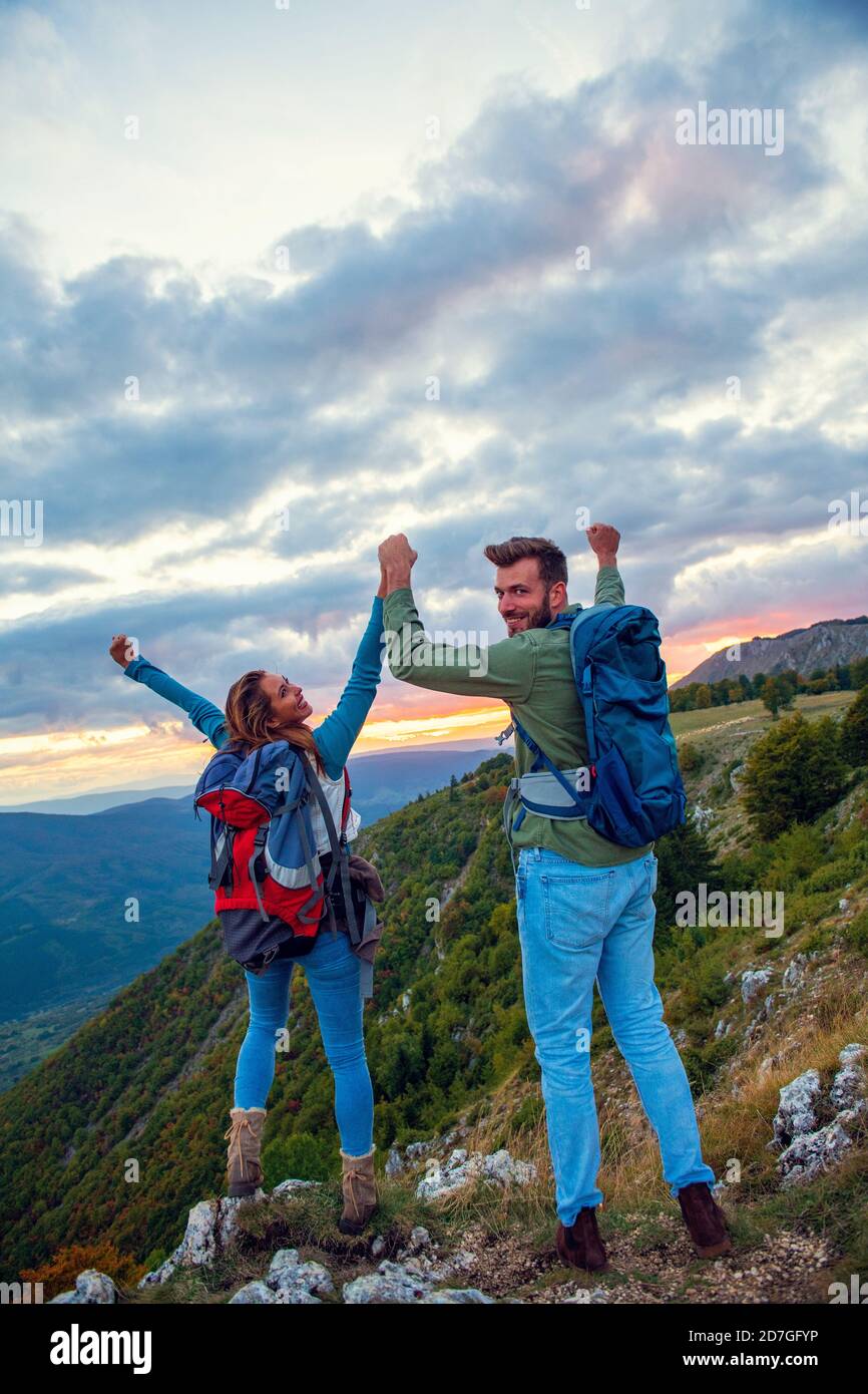 Victory mountain climb friends hi-res stock photography and images - Alamy