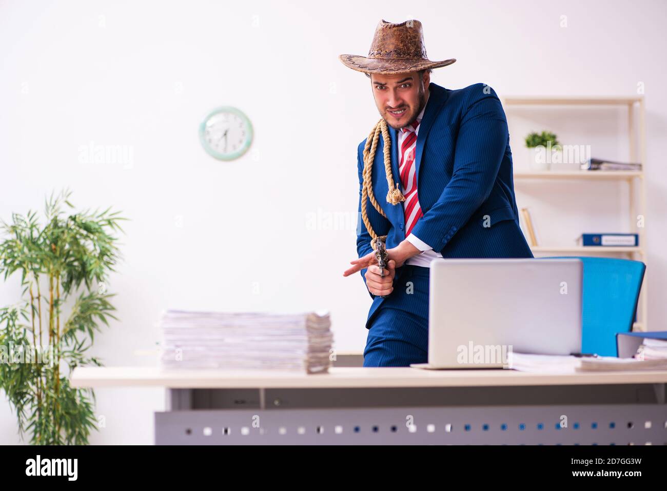 Angry businessman aiming gun hi-res stock photography and images - Alamy