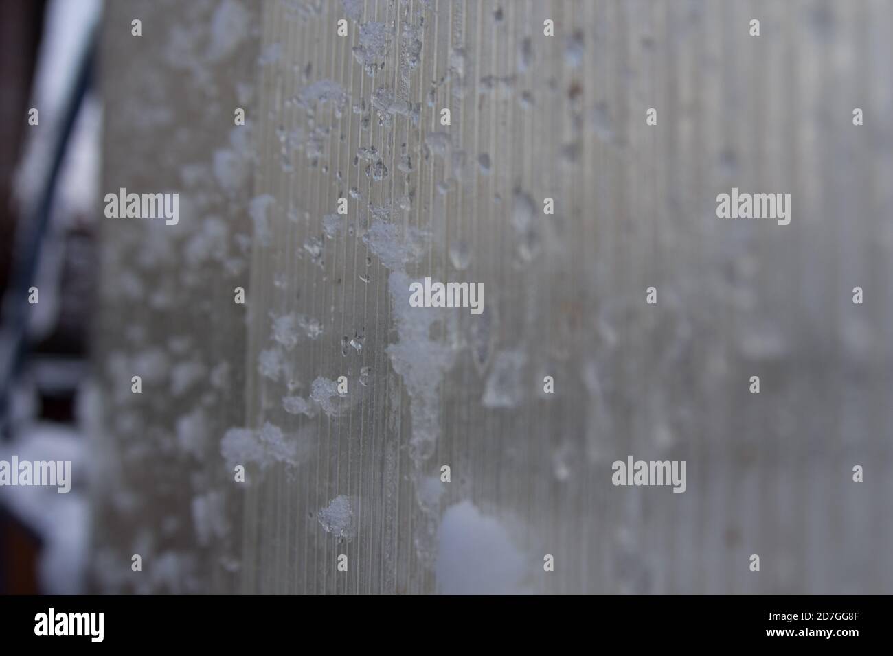 ice and snow on the glass wall of house Stock Photo - Alamy