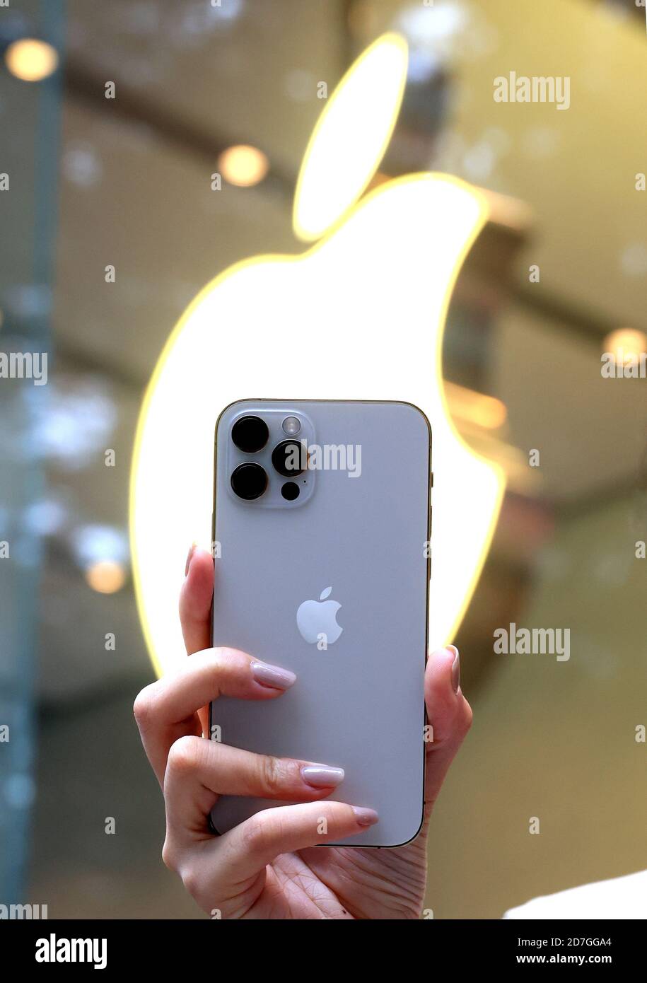 Tokyo, Japan. 23rd Oct, 2020. A customer displays her iPhone 12 as she ...