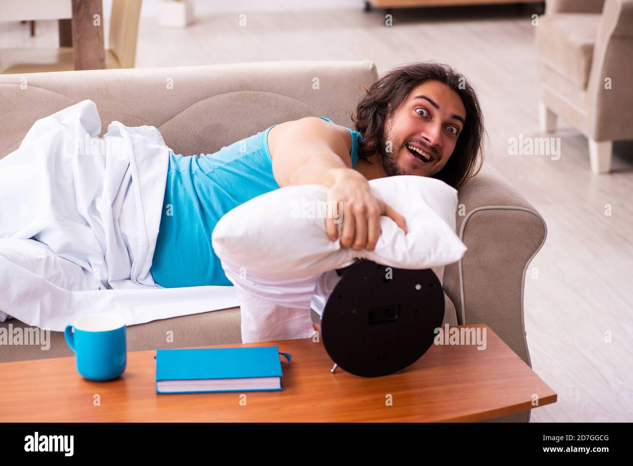 Lazy man on couch angry hi-res stock photography and images - Alamy