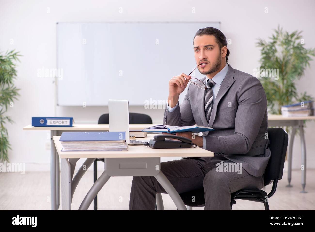 Male employee working in the office Stock Photo - Alamy