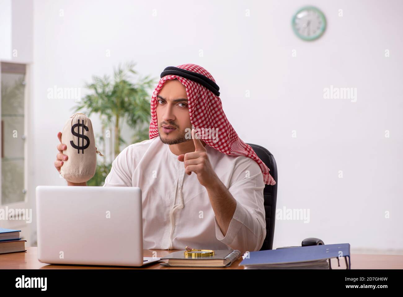 Male arab employee working in the office Stock Photo - Alamy