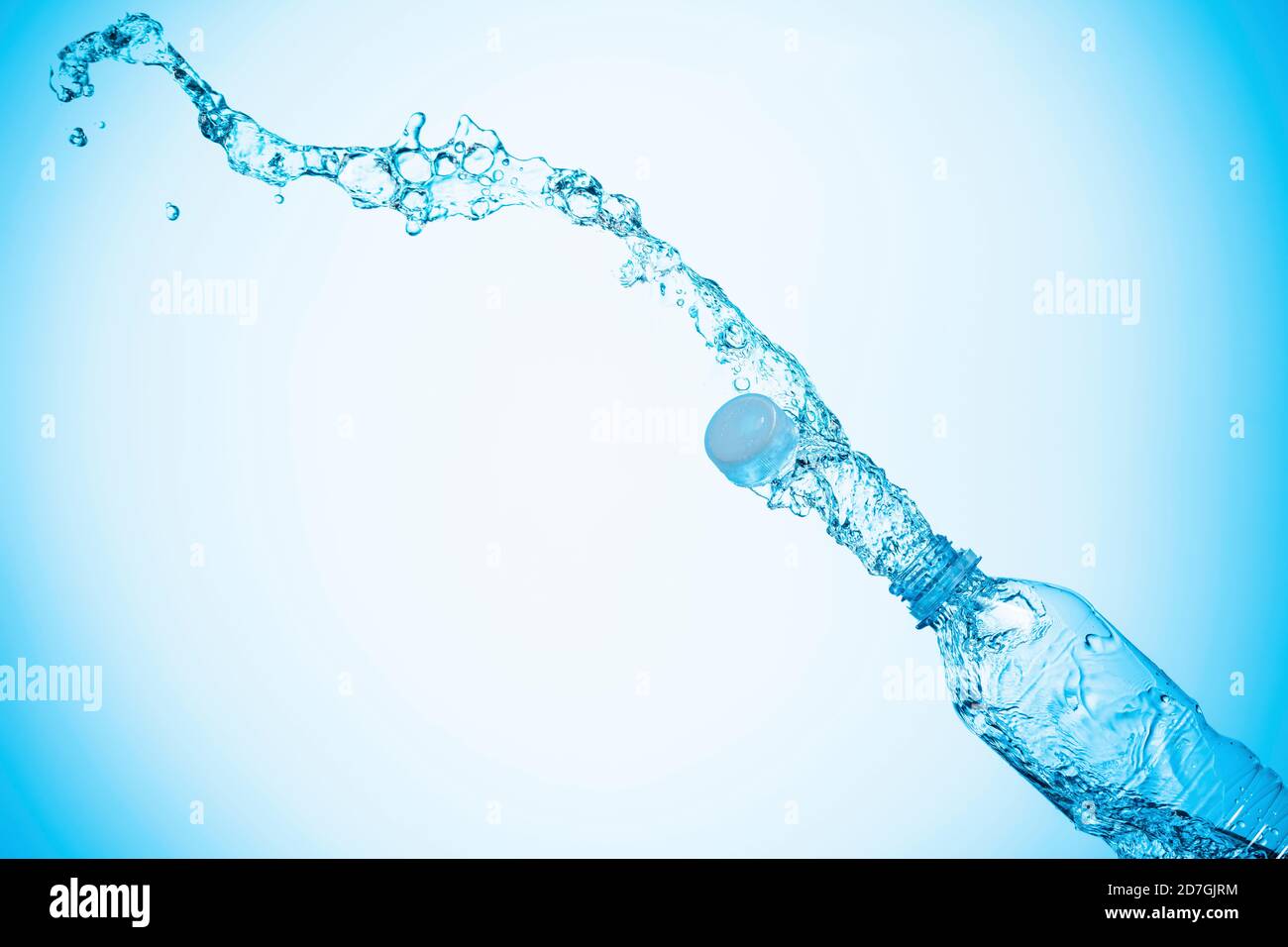 Water is poured out of a plastic bottle. Copy space Stock Photo - Alamy
