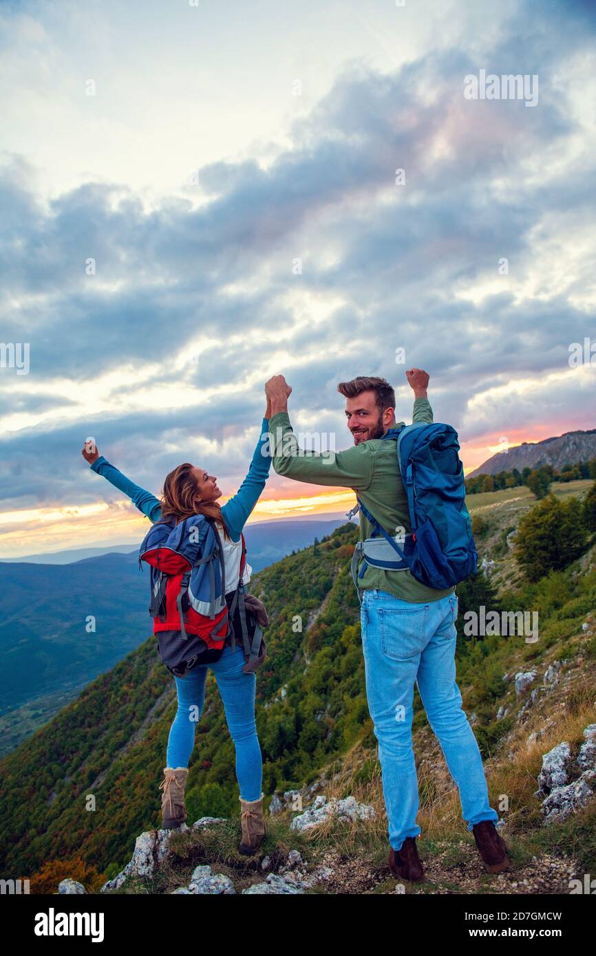 Victory mountain climb friends hi-res stock photography and images - Alamy