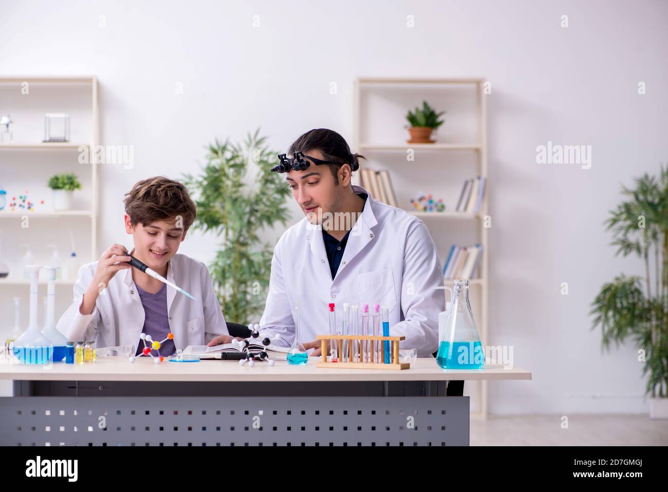 Young father and son chemists in the laboratory Stock Photo - Alamy