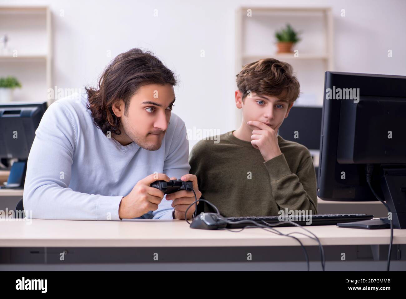 Father son playing videogame hi-res stock photography and images - Alamy