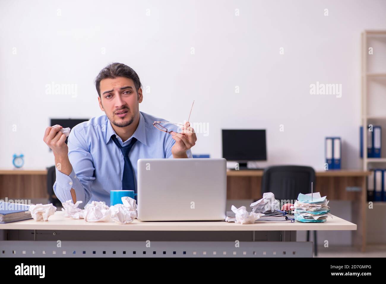 Sick male employee suffering at the workplace Stock Photo - Alamy