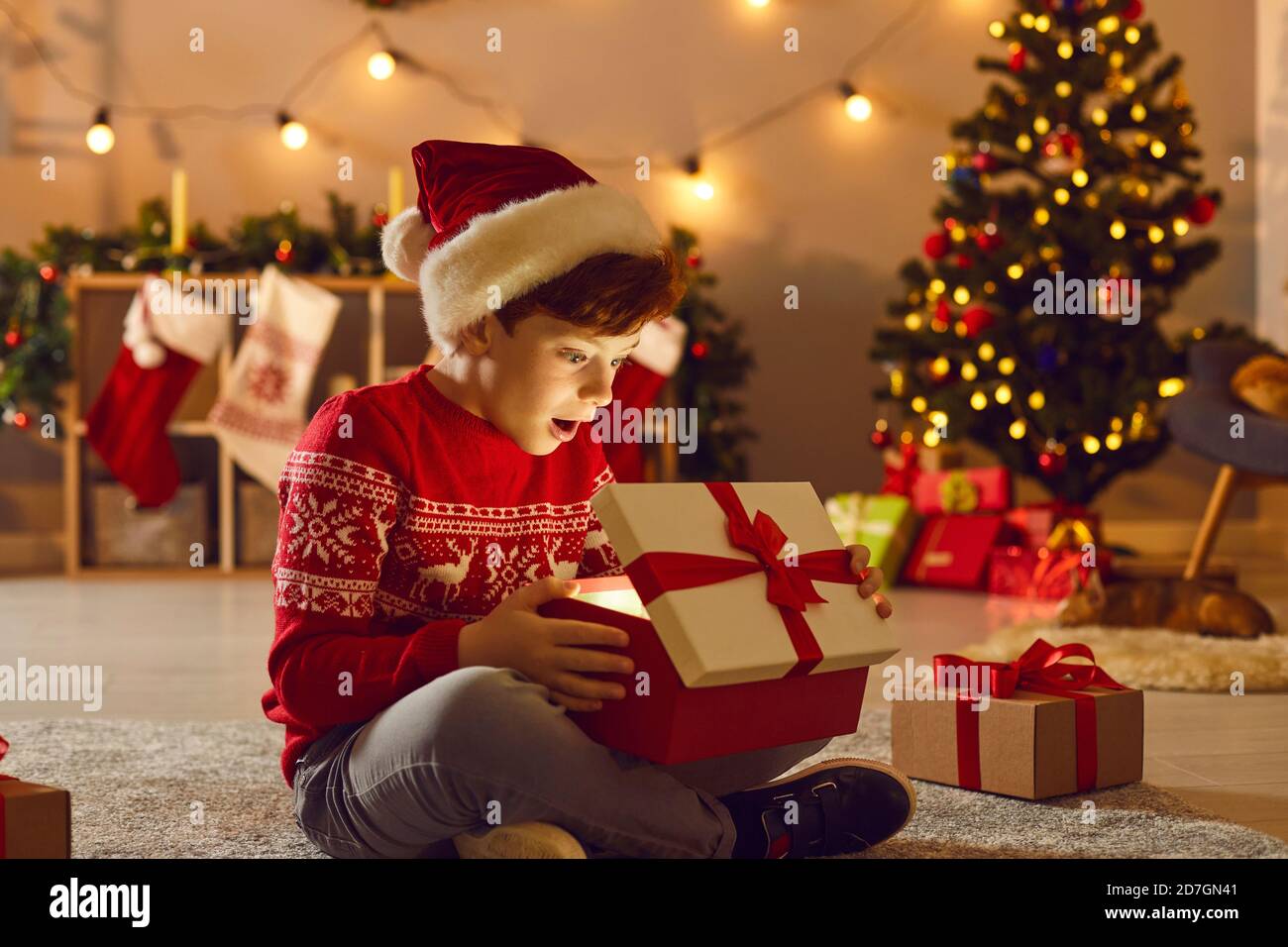 Boy opening box hi-res stock photography and images - Alamy
