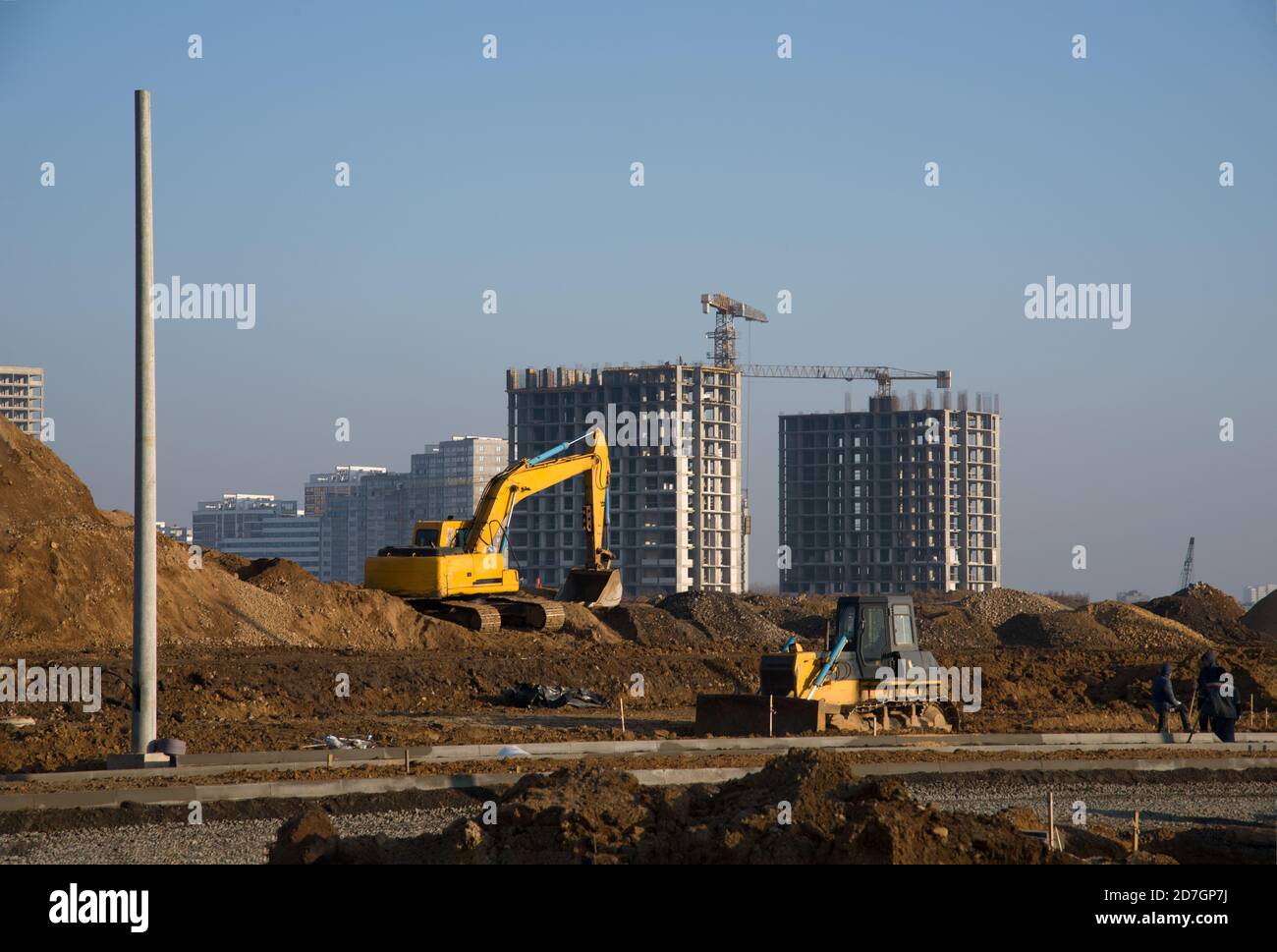 Excavator and bulldozer at a construction site on a background of a ...