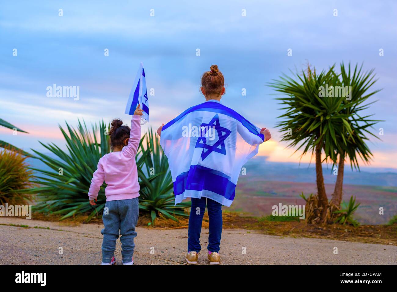 Happy girls with the flag of Israel at sunset outdoors Stock Photo - Alamy
