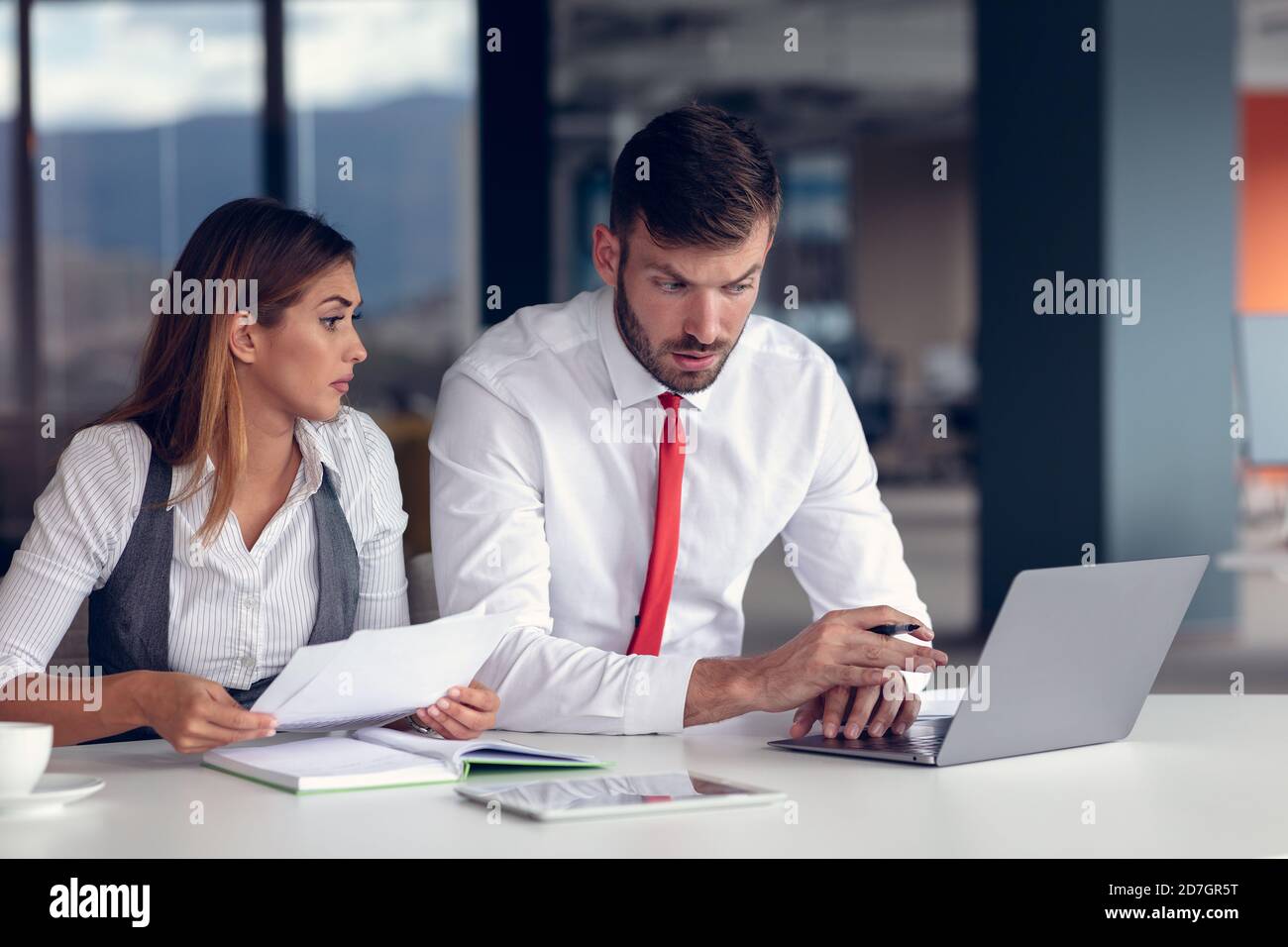 Business conflict. Business people arguing about document at the office ...