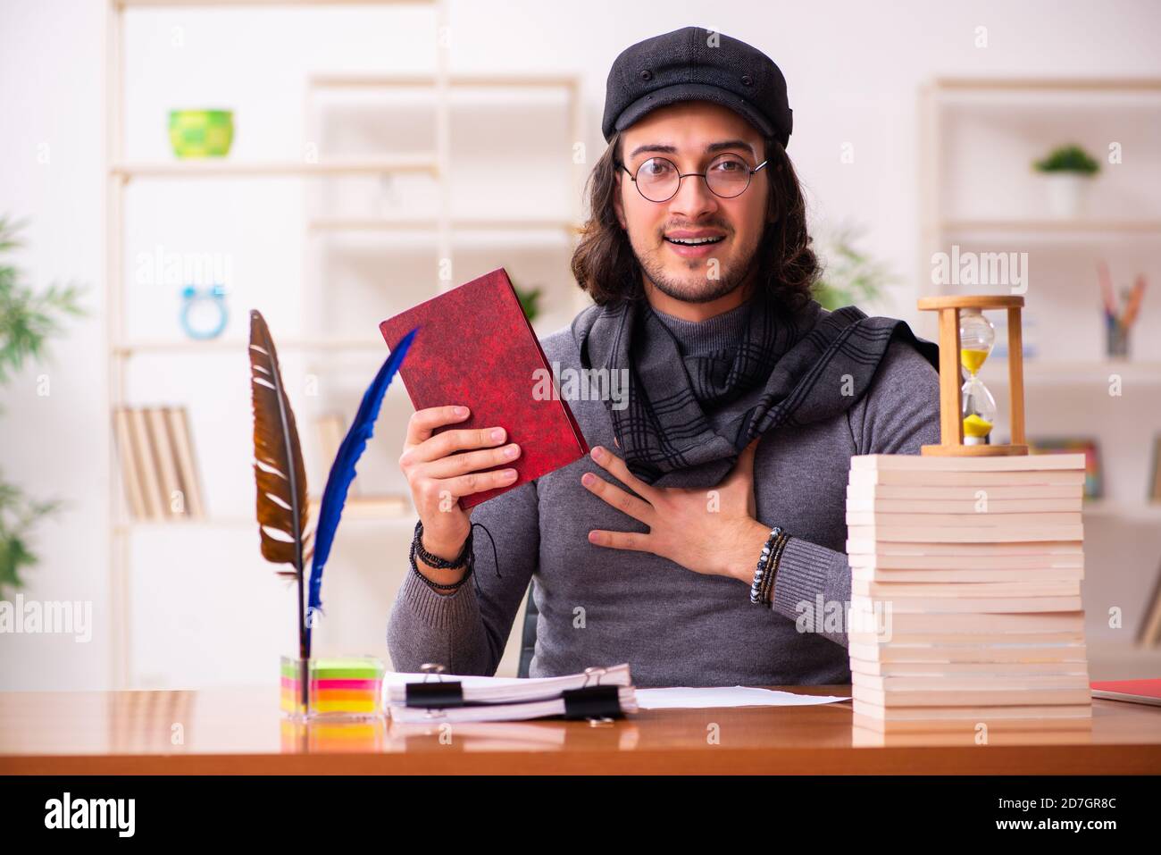 Male writer in time management concept Stock Photo - Alamy