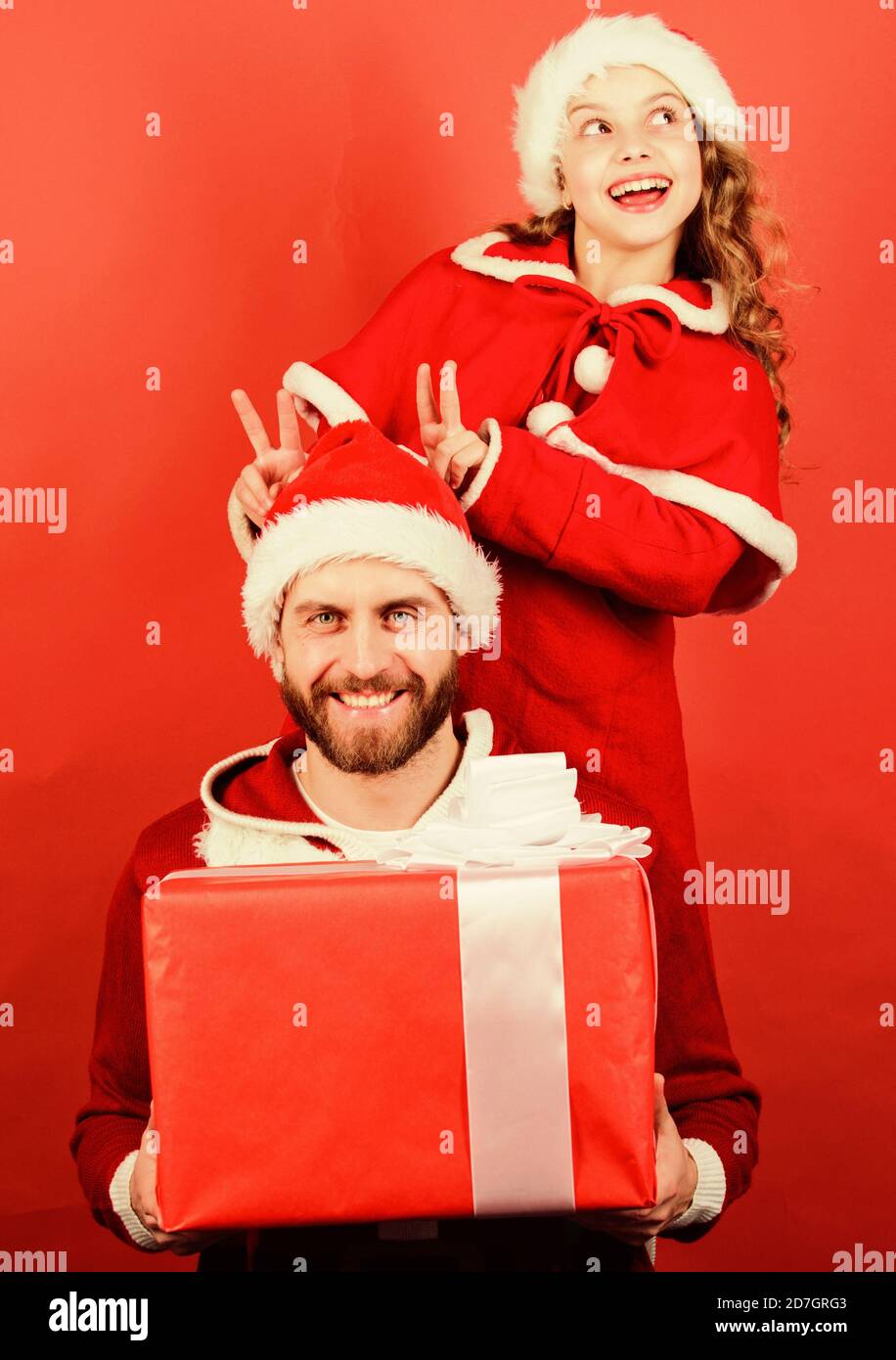 Christmas gift for child. Dad in santa costume and daughter cute kid ...